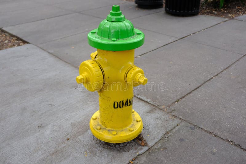 Closeup of a Yellow Fire Hydrant in the Street Stock Photo - Image of ...