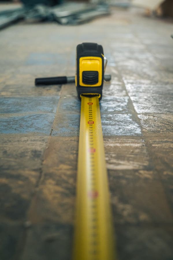 Closeup of a Yellow Measuring Tape on the Ground Stock Image - Image of ...
