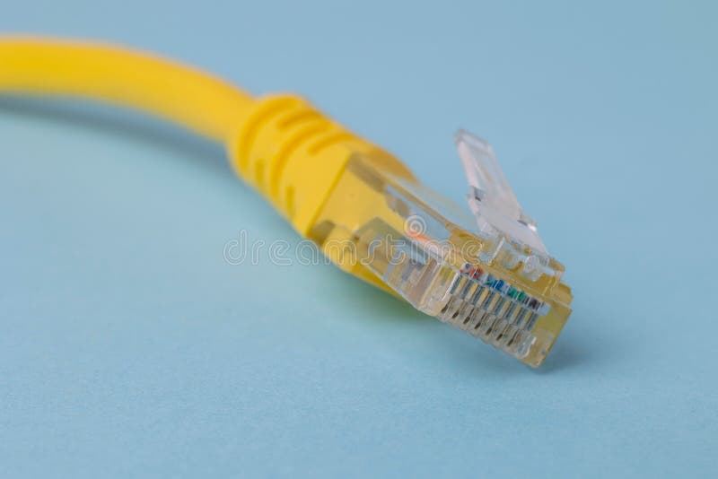 Closeup of Yellow Patch Cord in Blue Background Stock Photo - Image of ...