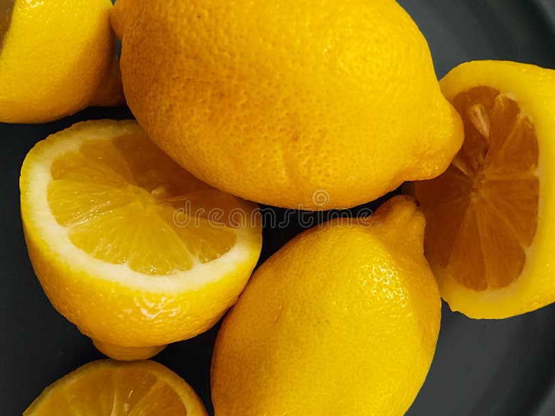 Closeup Yellow Whole and Sliced Lemons Stock Image - Image of vitamin ...