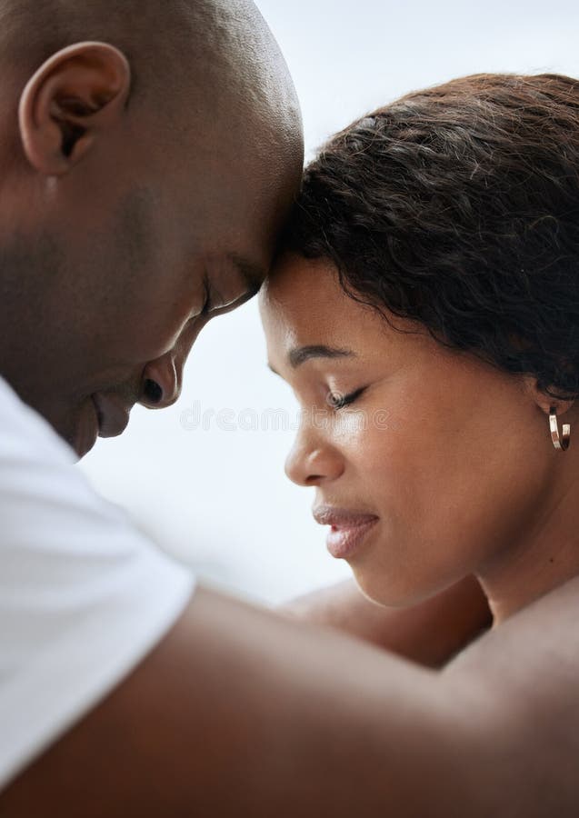 Closeup Of A Young African American Married Couple Standing Face To