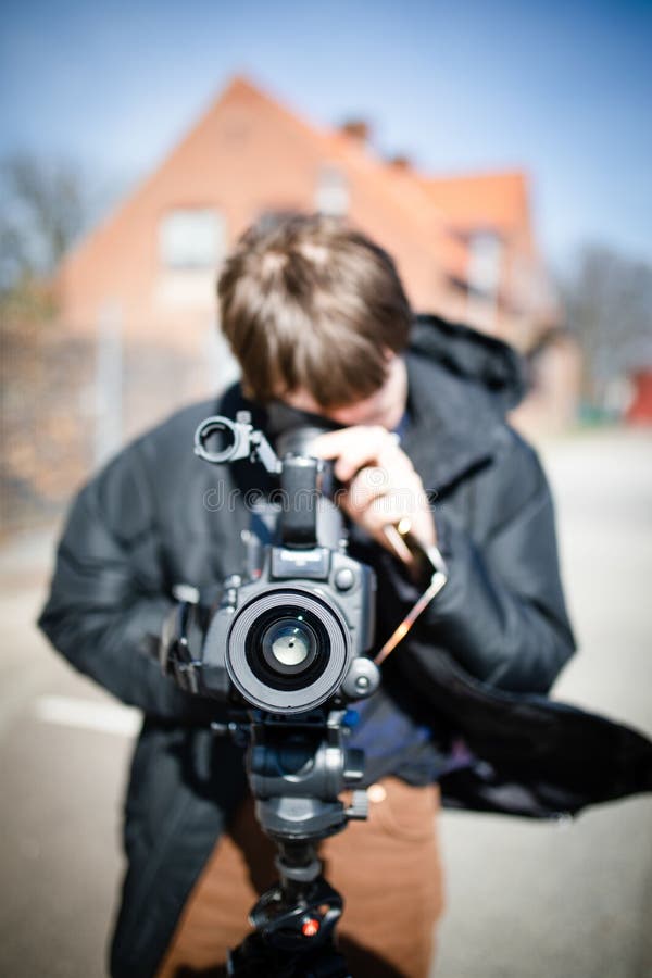 Closeup of a Young Boy Holding a Professional Camera Stock Photo ...