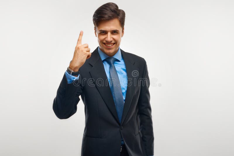 Closeup of a Young Business Man Showing Numbers. One Stock Photo ...