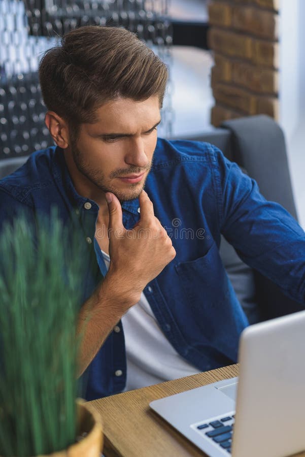 Closeup of Young Freelancer Thinking while Looking at Laptop Stock ...