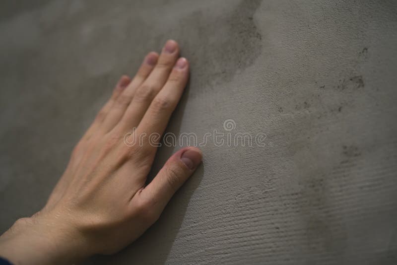 Young Man Hand Touching Concrete Wall Stock Photos - Free & Royalty ...