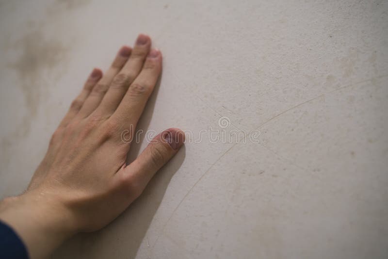 Closeup Young Man Hand Touching Plastered Wall Stock Image - Image of ...