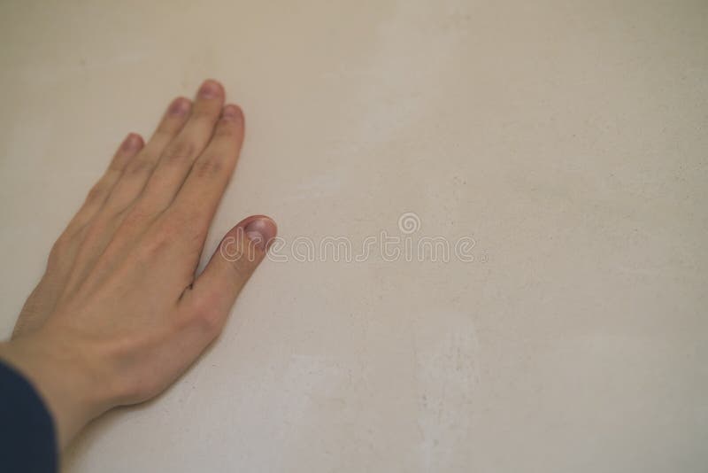 Closeup Young Man Hand Touching Plastered Wall Stock Photo - Image of ...