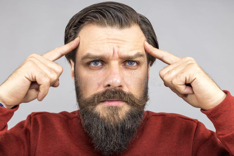 Closeup Of Young Man Thinking Hard Stock Photo - Image: 62857578