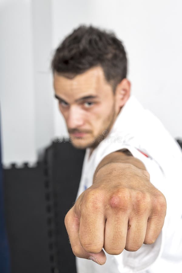 Closeup of Young Man Throwing a Punch during His Training Stock Photo ...