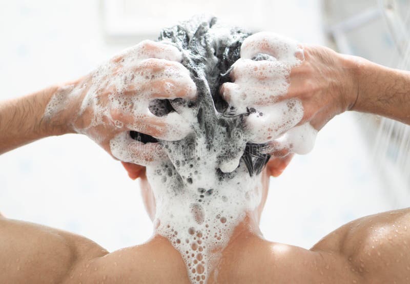 Closeup Young Man Washing Hair With With Shampoo In The Bathroom