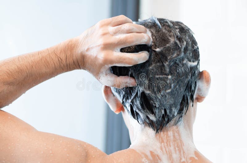 Closeup Young Man Washing Hair With With Shampoo In The Bathroom