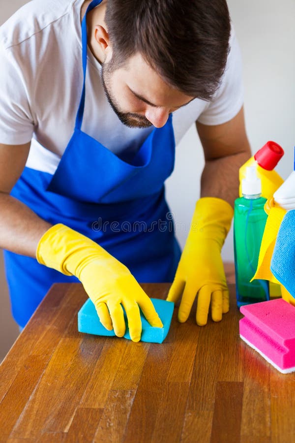 Closeup of Young Man Wearing Apron Cleaning Kitchen Worktop Stock Image ...