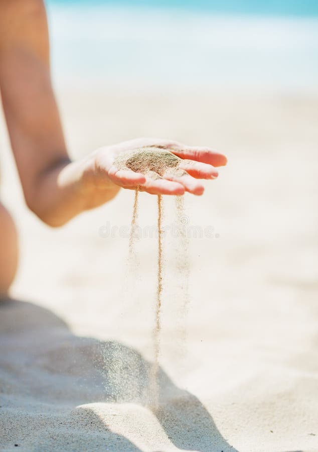Closeup on Young Woman Sitting on Beach and Playing with Sand Stock ...
