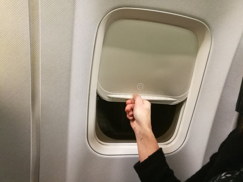 Closing of the Airplane Window Stock Image - Image of window, airplane ...