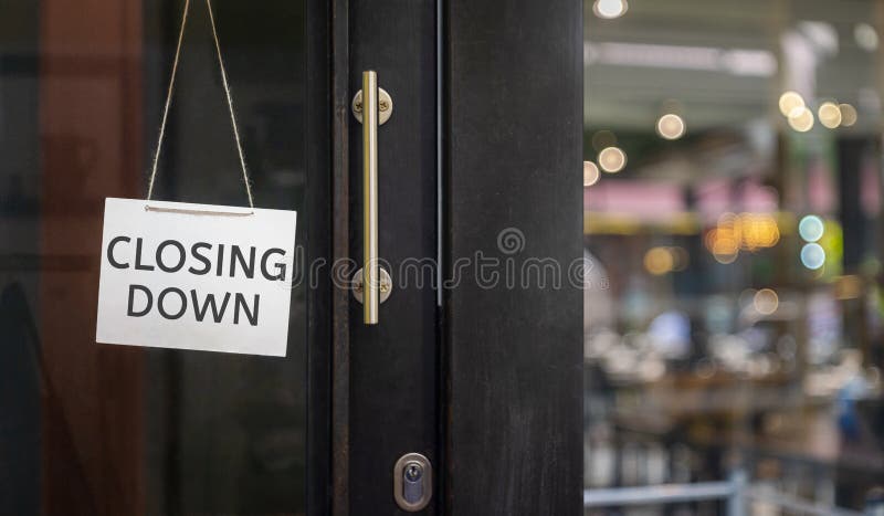 Closing Down Sign Painted on the Window of a Dress Shop Stock Photo ...