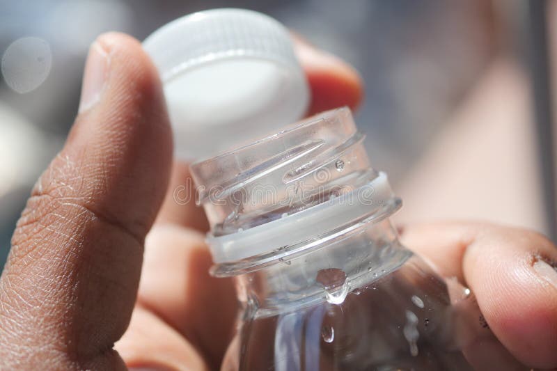 Closing a Water Bottle Cap while Outdoors on a Sunny Day Stock Photo ...