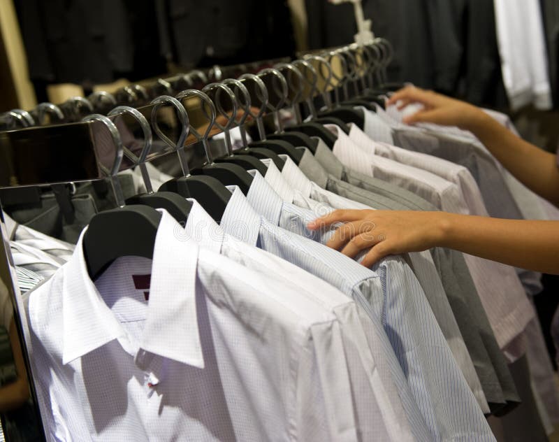Cloth hangers with shirts stock image. Image of boutique - 22314903