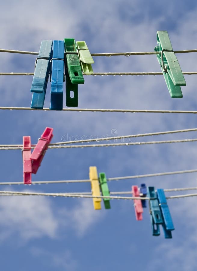 Cloth line with color pegs stock image. Image of blue - 15595069