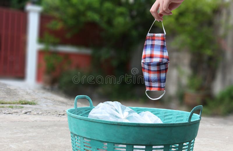 The Cloth Mask in Hand and Waste Bin Stock Photo - Image of social ...