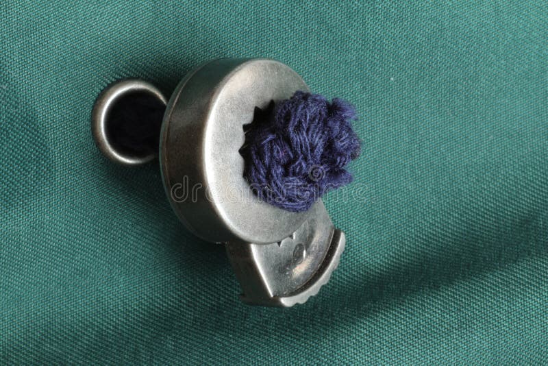 Cloth texture with clasp. stock photo. Image of petal - 208500596