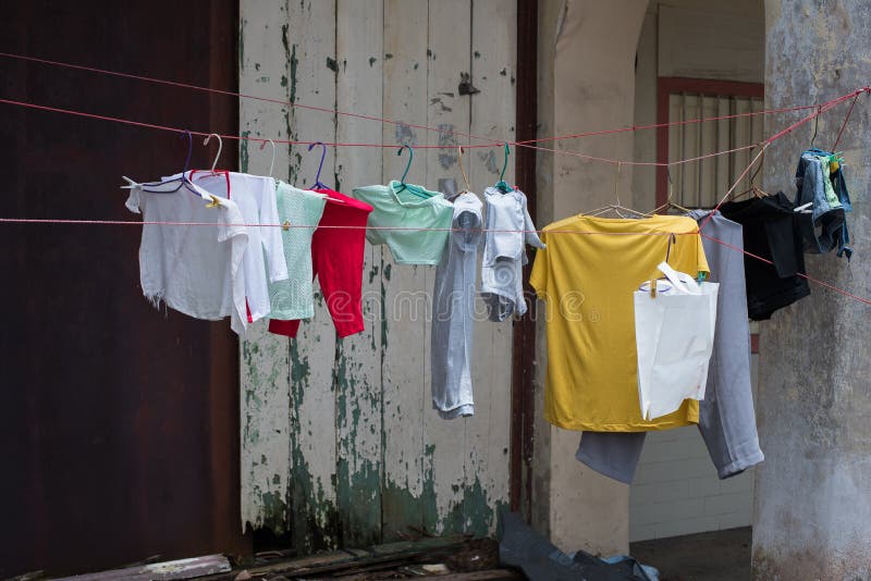Clothes on clothesline stock photo. Image of fabric, hang - 90075208