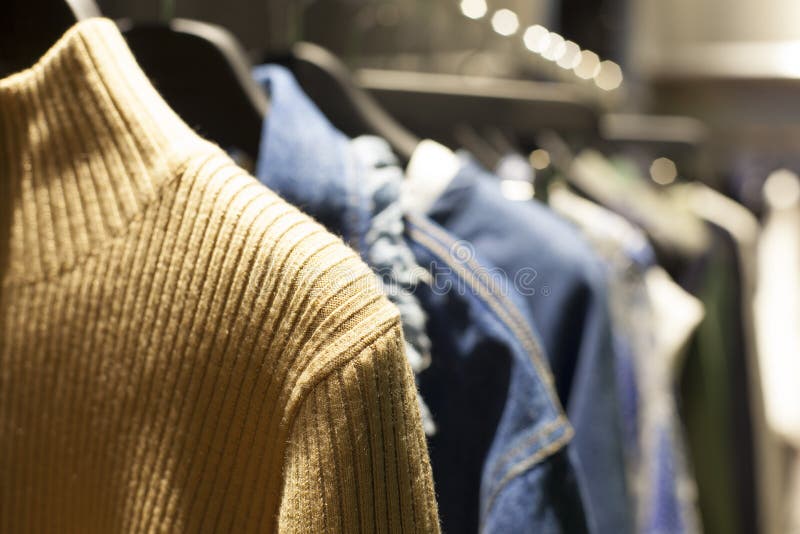 Clothes on clothing rack stock image. Image of wood - 100737425