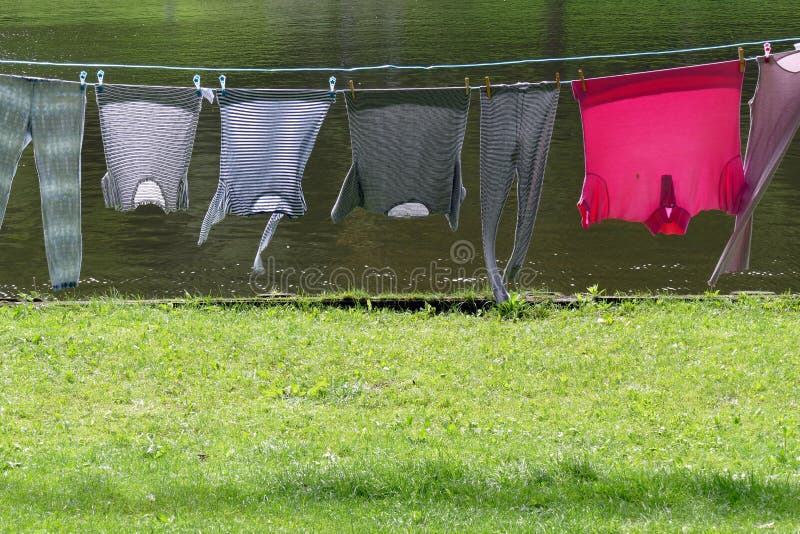 Clothes dry in the wind stock photo. Image of leash - 106696694