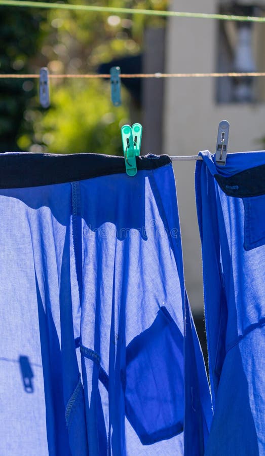Clothes Drying on a Clothesline Stock Photo - Image of clothesline ...