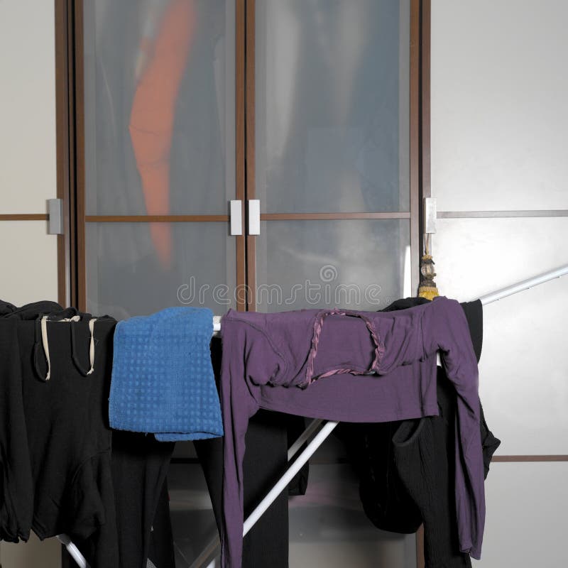 Clothes on Drying Rack stock image. Image of indoor, doors - 65367703