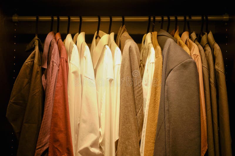 Clothes Hang on a Hanger in the Closet Stock Photo - Image of fabric ...