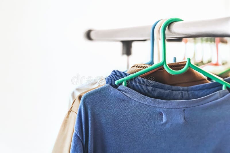 Clothes hang on a rack stock image. Image of rack, hangers - 156924297