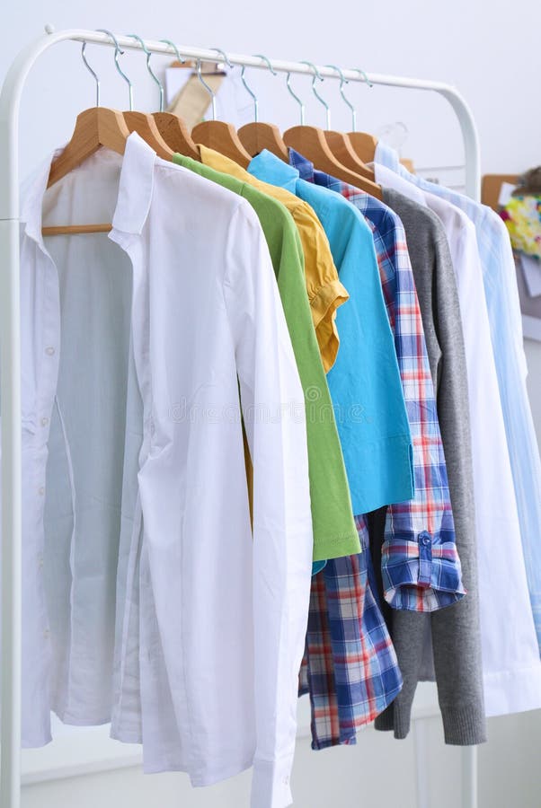 Clothes Hang on a Shelf in Designer Clothes Store Stock Image - Image ...