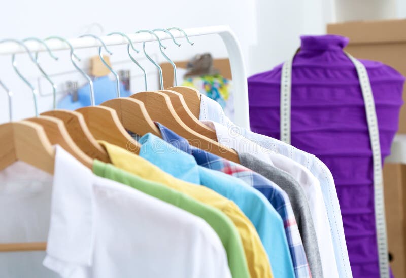 Clothes Hang on a Shelf in Designer Clothes Store Stock Image - Image ...