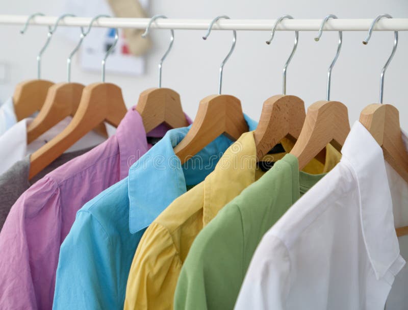 Clothes Hang on a Shelf in Designer Clothes Store Stock Image - Image ...