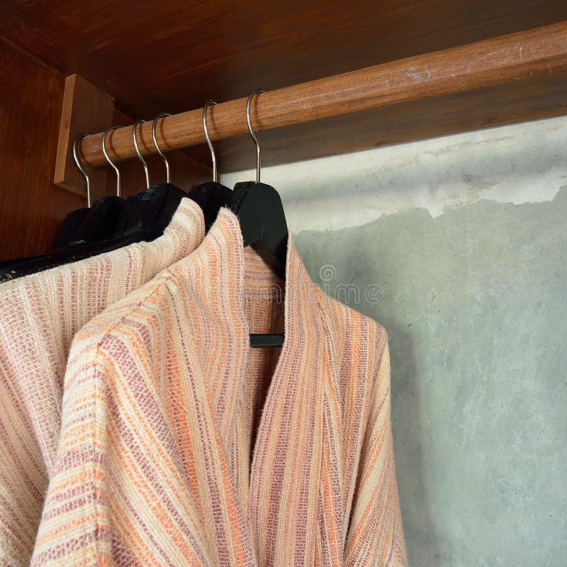 Clothes Hanger and Bathrobe in Wardrobe Stock Image - Image of clean ...