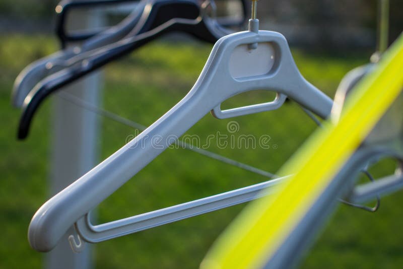 Clothes Hangers of Multiple Colors Behind Each Other in a Line Stock ...