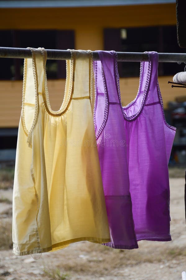 Clothes Hanging on Bamboo Pole Stock Image - Image of female, hang ...