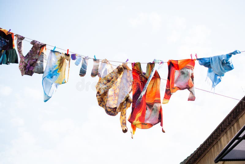 Clothes Hanging from a Clothesline Rope in Street Stock Image - Image ...