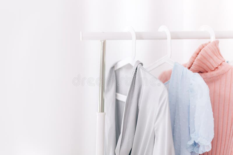 Clothes hanging on hangers stock photo. Image of clothing - 177430232