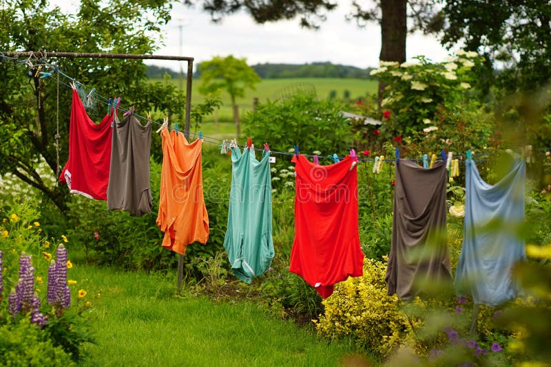 Clothes Hanging On Line In Garden Stock Photo - Image of baby, drying ...