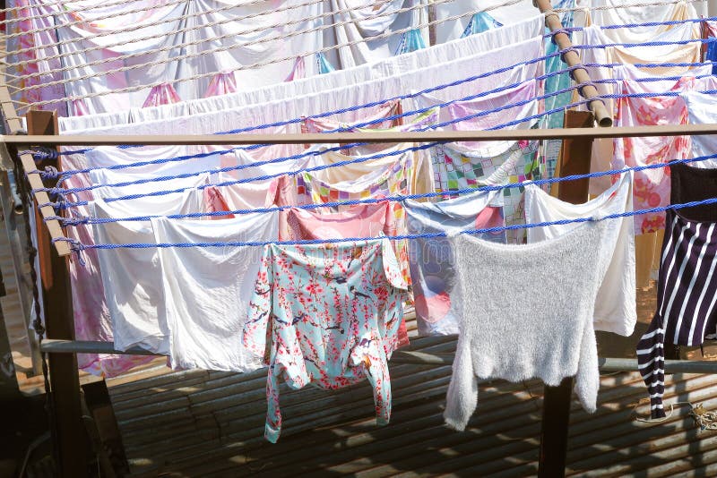Clothes Hanging Out on Rope To Dry Stock Photo - Image of outside ...