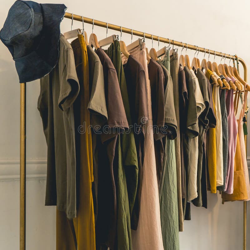 Clothes Hanging on a Rack in a Showroom Stock Image - Image of fabric ...