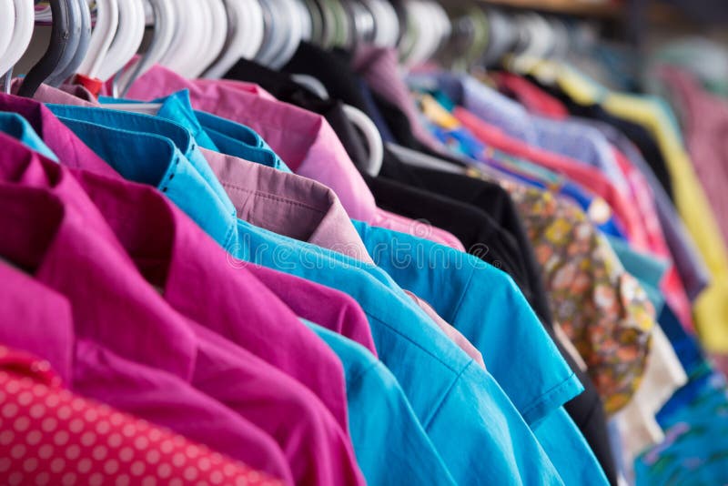 Clothes Hanging on the Rack in the Store Stock Image - Image of retail ...