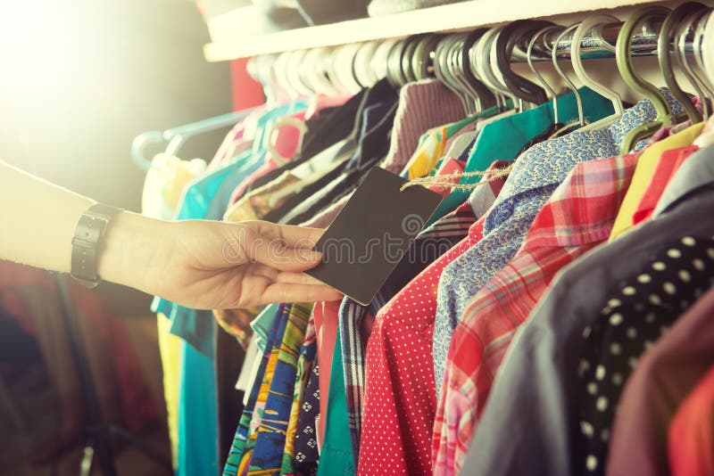 Clothes Hanging on the Rack in the Store Stock Image - Image of ...