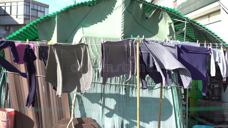 Clothes hanging slum stock video. Video of hanging, home - 218102795