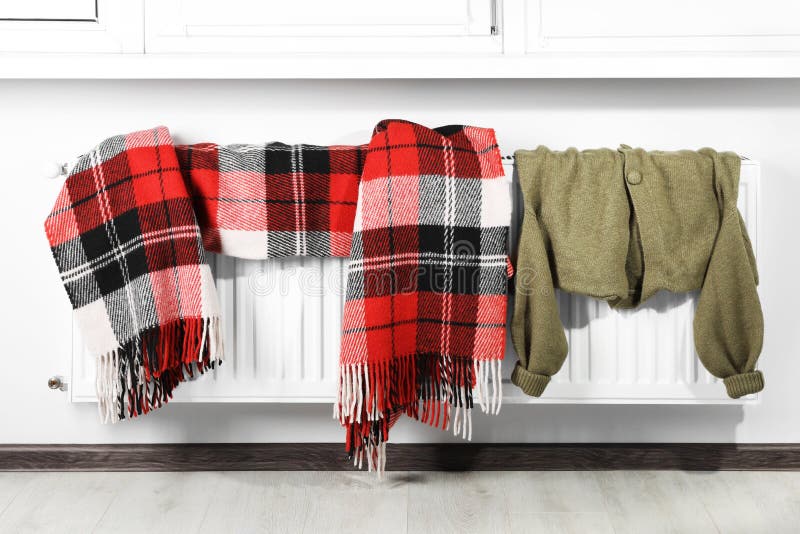 Clothes Hanging on White Radiator in Room Stock Photo - Image of color ...