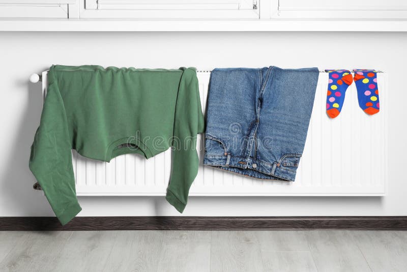 Clothes Hanging on White Radiator in Room Stock Photo - Image of house ...