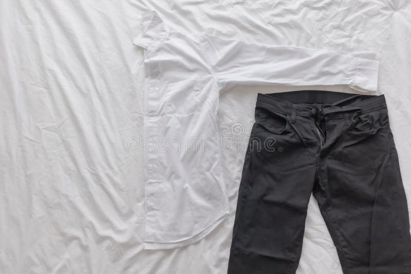 Clothes Lying on the Bed in the Bedroom in Concept of Preparation ...