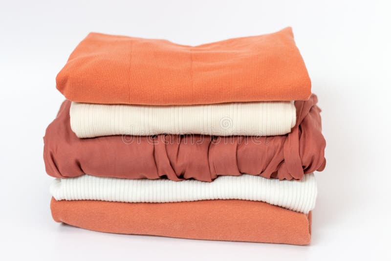 Clothes Neatly Folded into Stack on White Background, Front View Stock ...