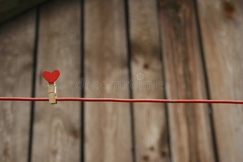Clothes Peg with a Red Heart on a String Against the Background Stock ...